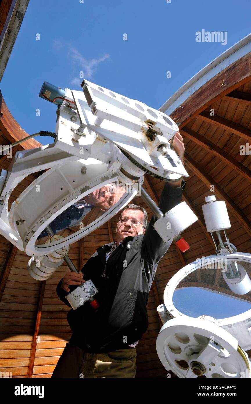 Solar observatory. Astronomer checking the telescope in an observatory ...