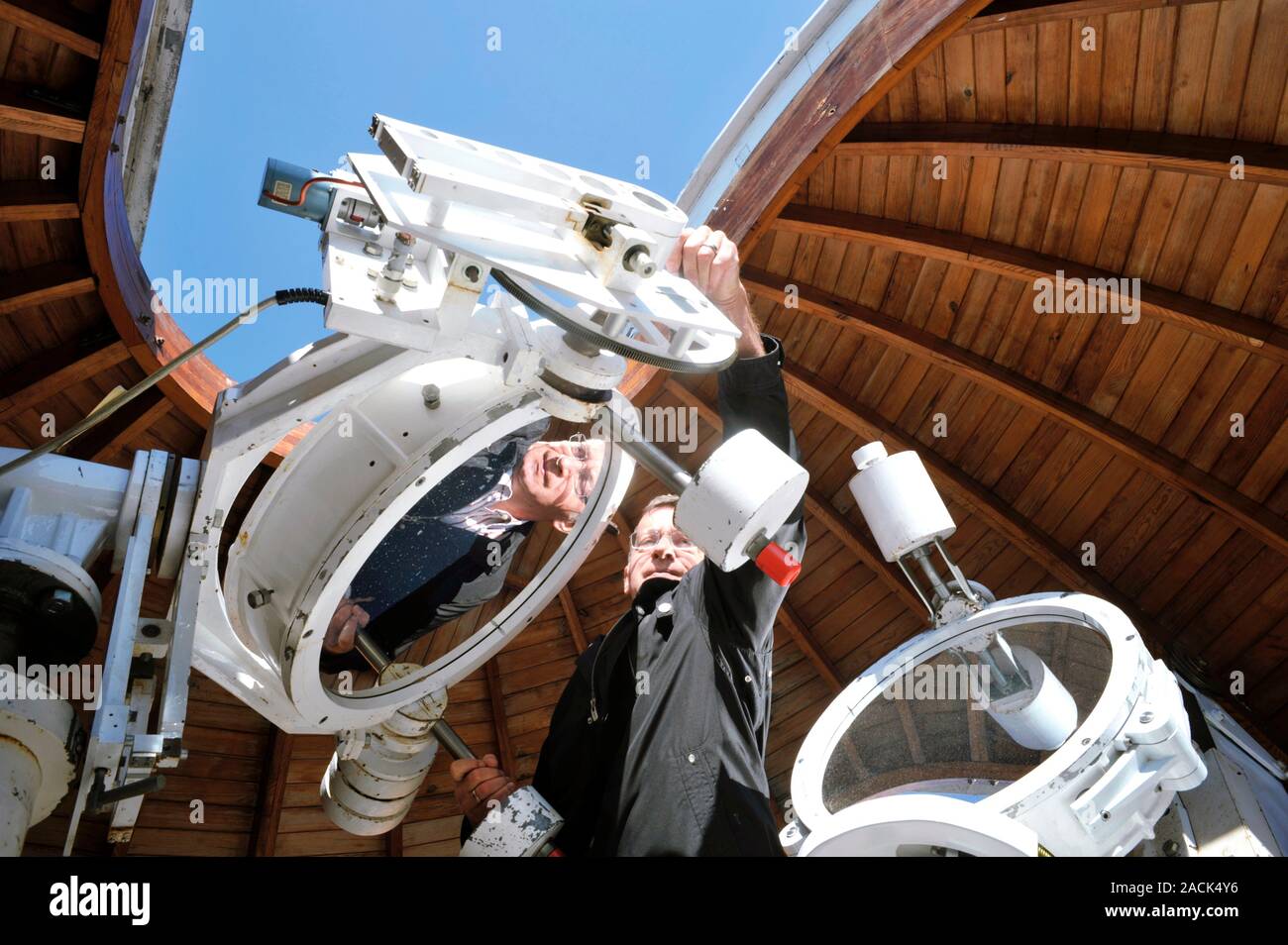 Solar observatory. Astronomers checking the telescope in an observatory ...