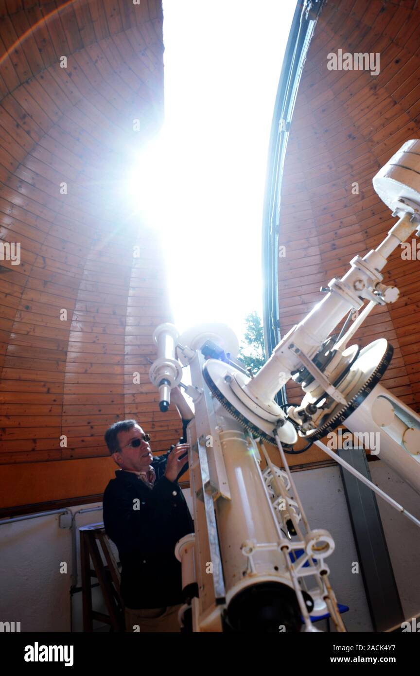 Solar observatory. Astronomer checking the telescope in an observatory ...