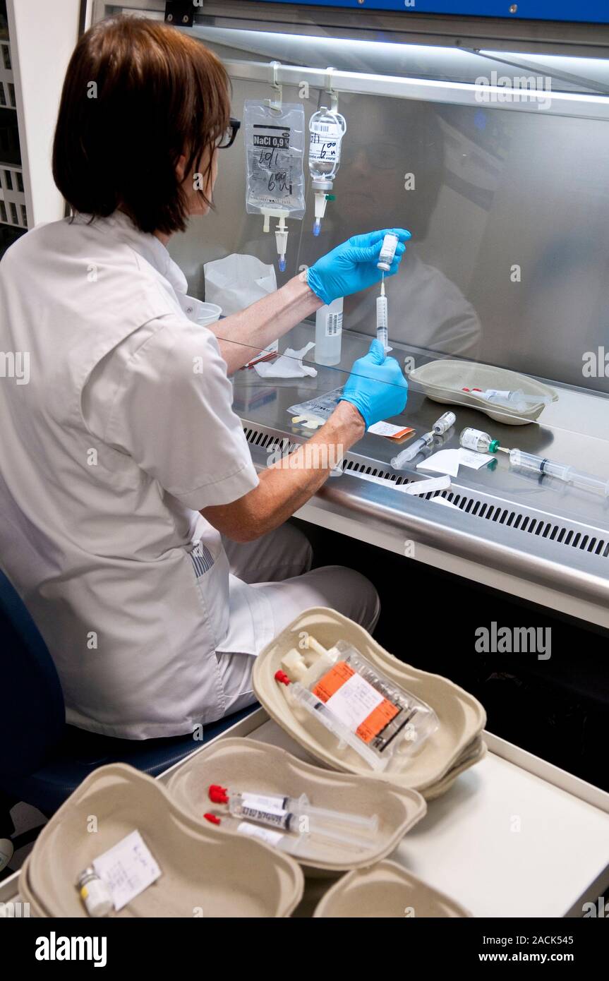 Infusion preparation. Nurse preparing a drug to be administered ...