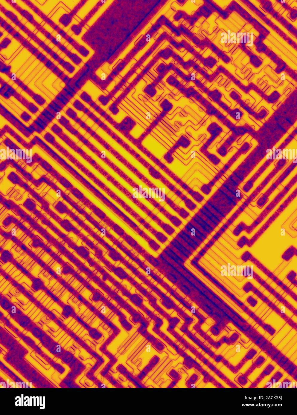Microchip. Light micrograph of the surface of a microchip using dark ...