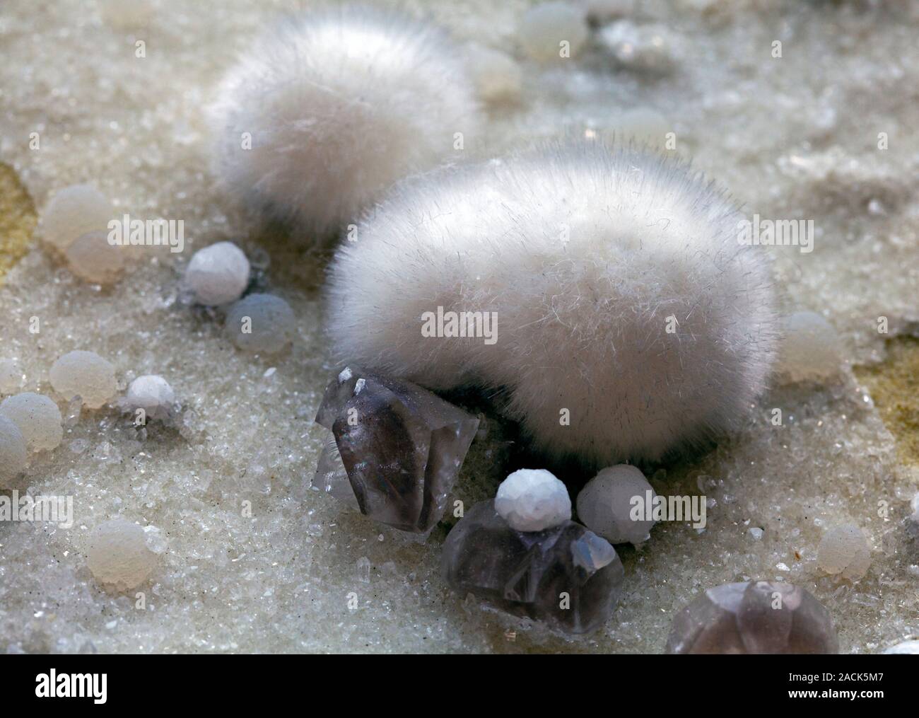 Okenite, a hydrated calcium silicate hydroxide, chemical formula ...