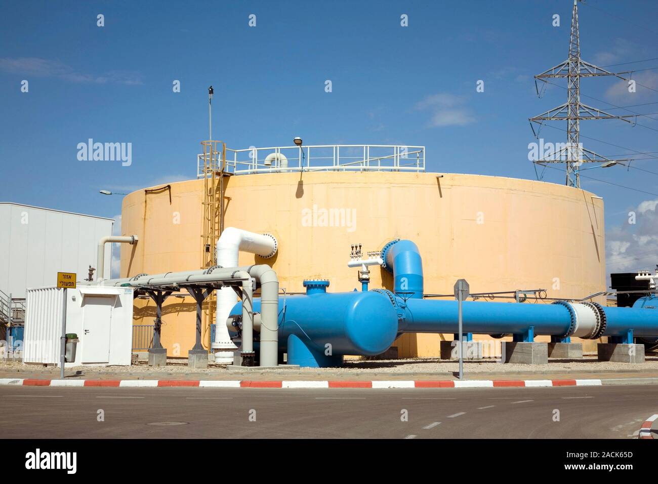 Desalination plant. Tank storing water that has been purified at a ...