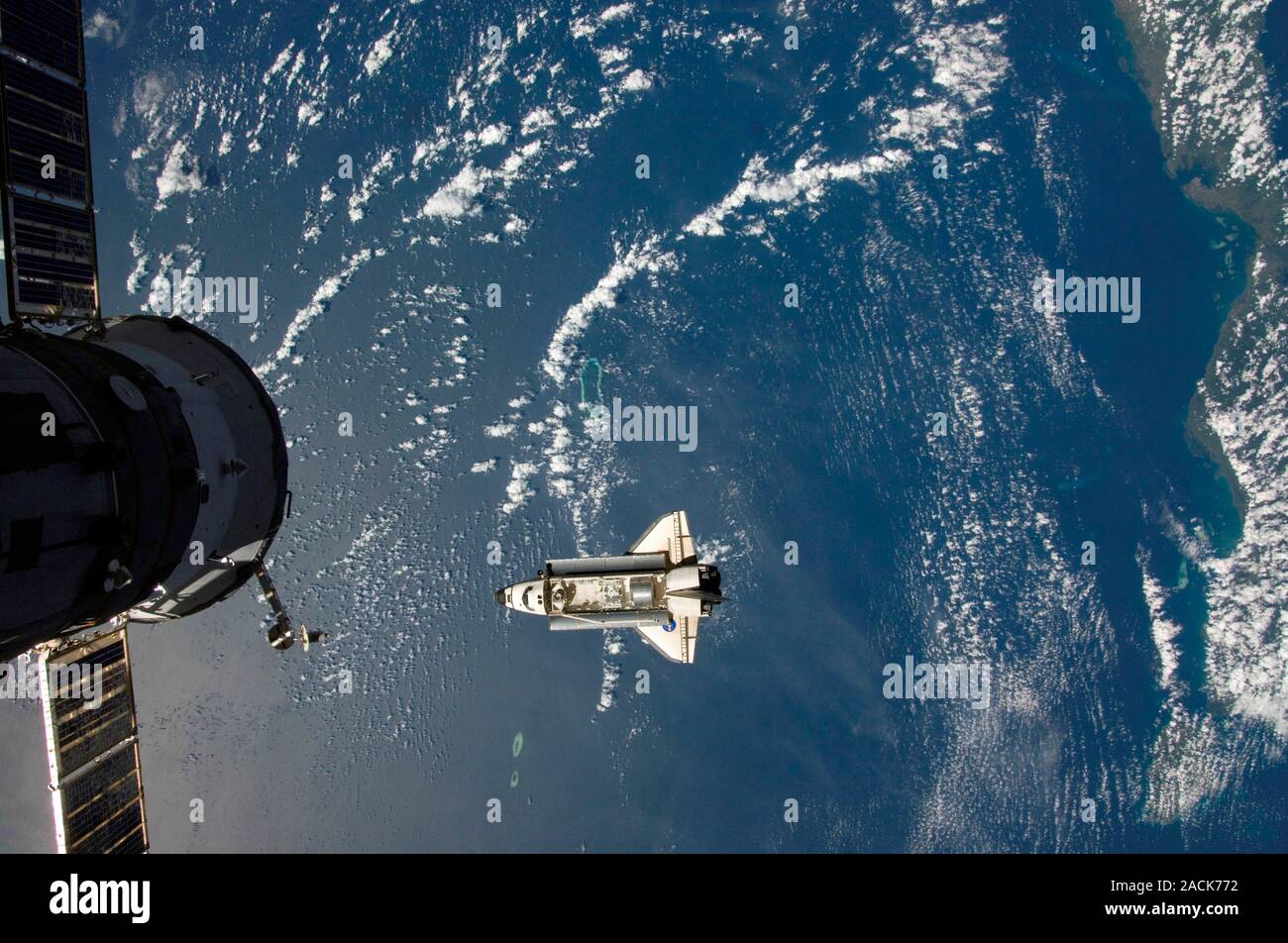 Space Shuttle Endeavour approaching the International Space Station ...