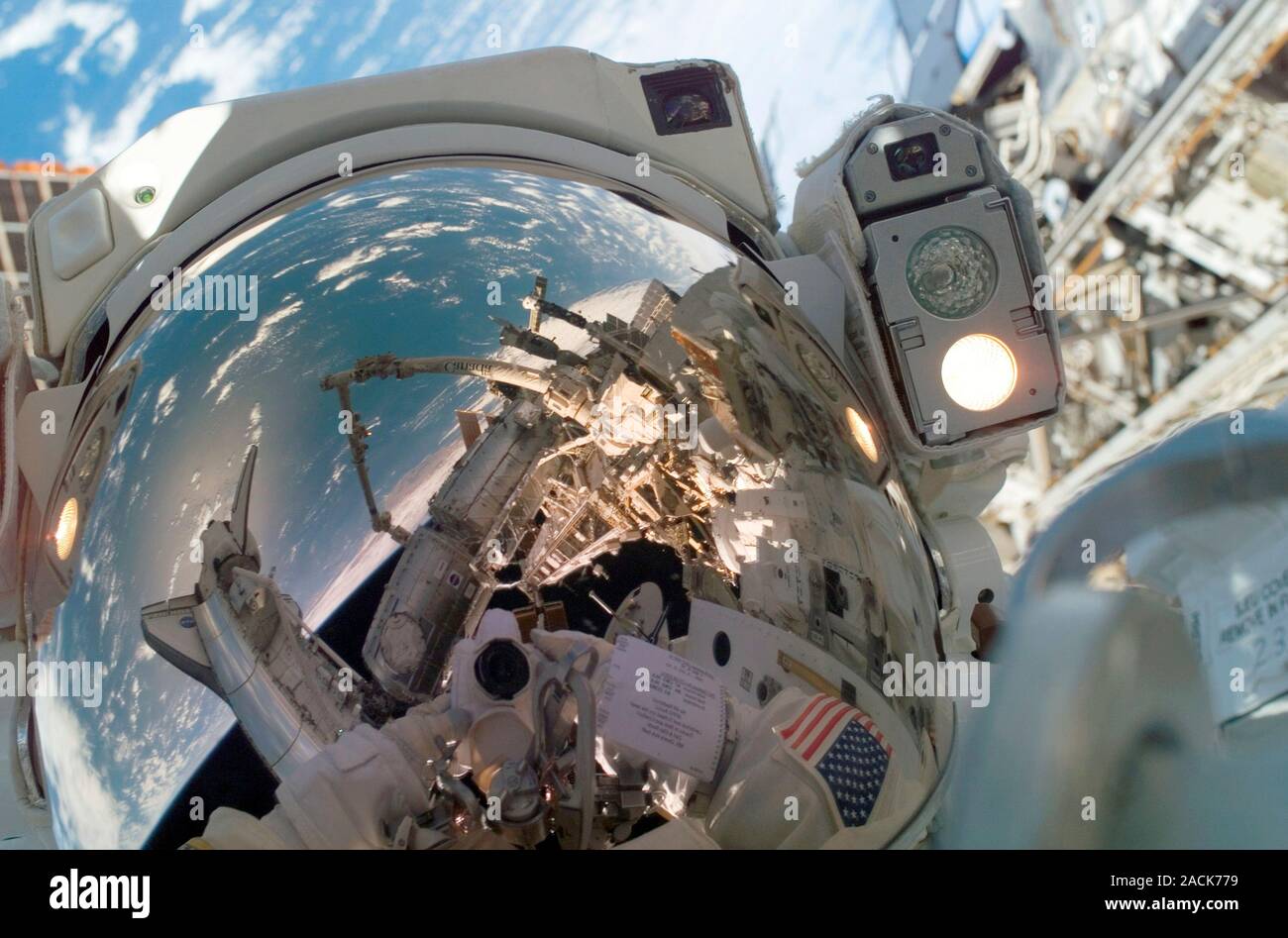 Astronaut self portrait. Flight engineer Garrett Reisman taking a self ...