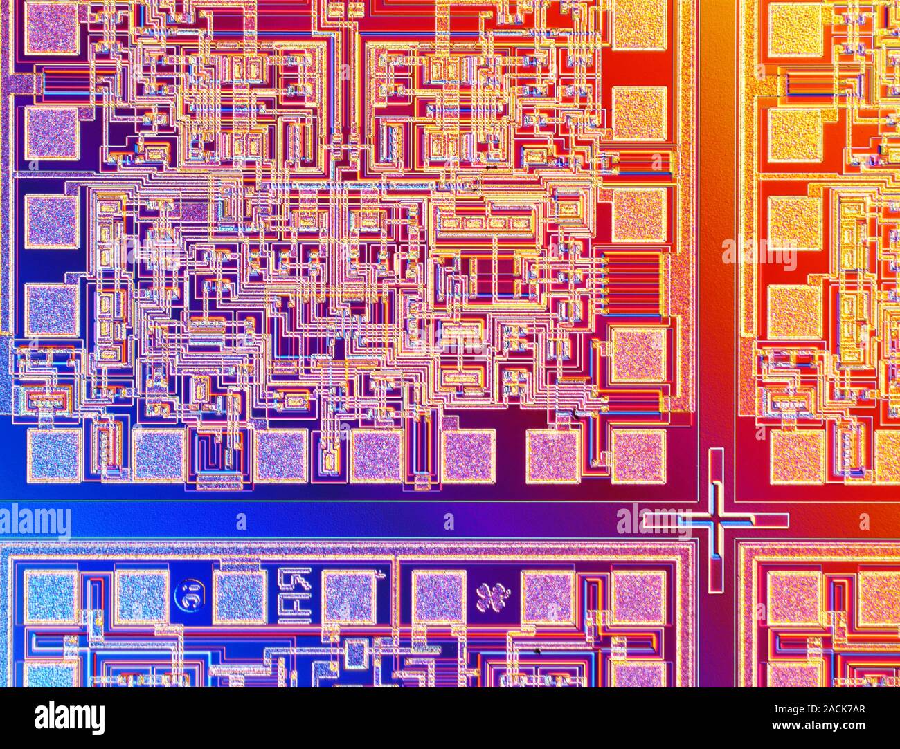 Microchip. Light micrograph of the surface of a microchip using ...
