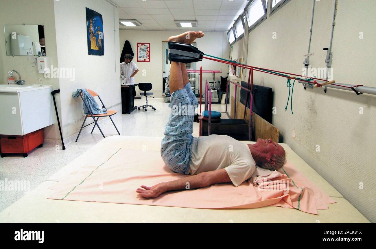 Geriatric rehabilitation therapy. Elderly patient exercising in the ...