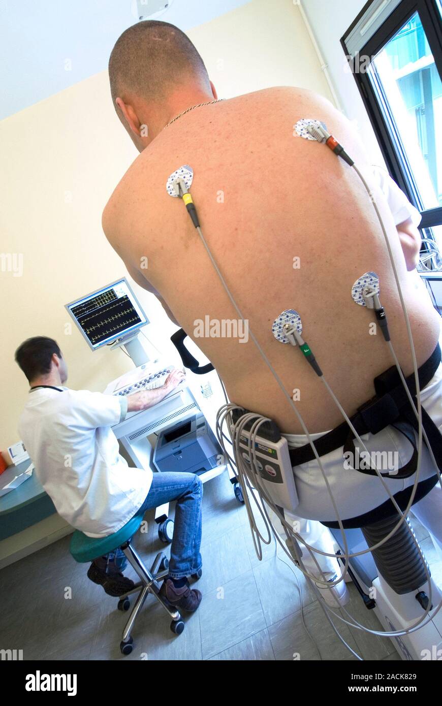 Cardiac stress test. Electrodes attached to a patient undergoing a ...
