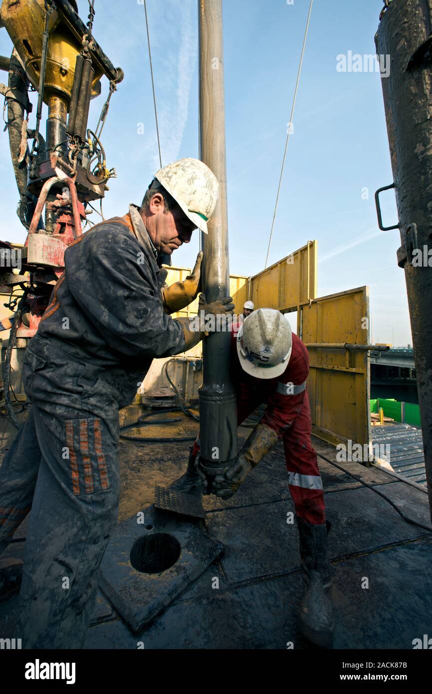 Geothermal well construction. Workers drilling a new well at the site ...