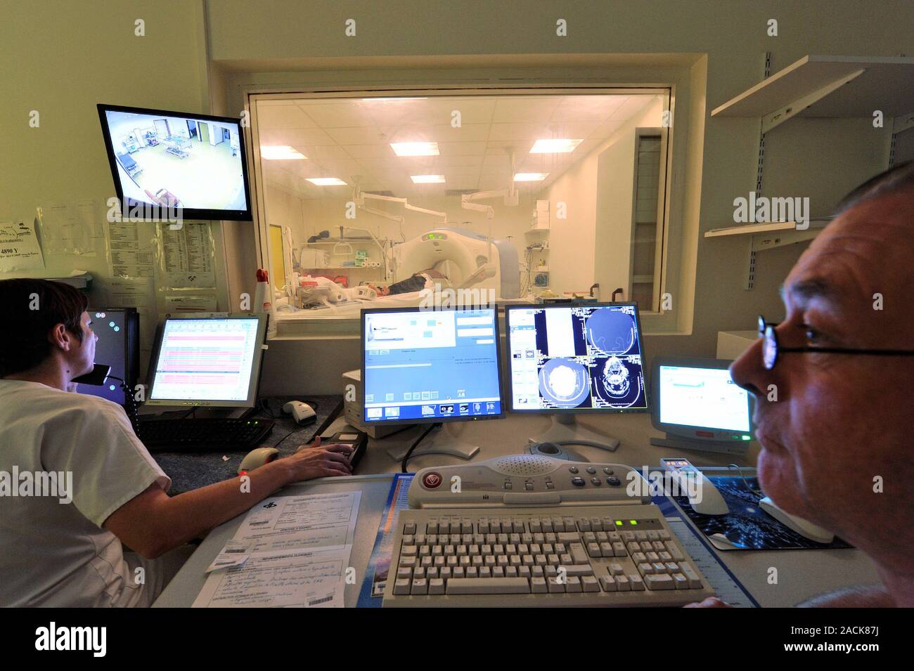 MRI scan. Radiologists in the control room of an MRI (magnetic ...