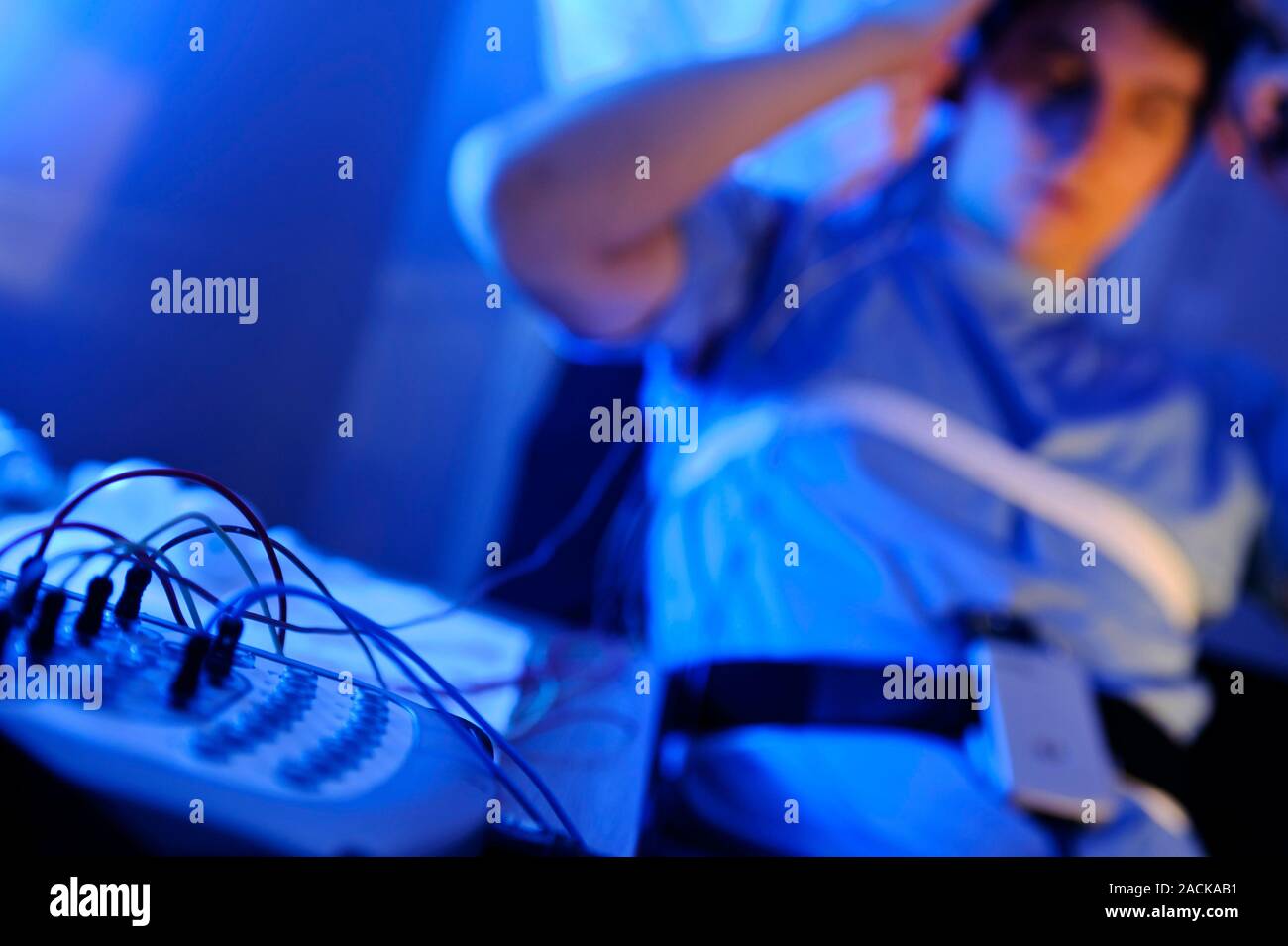 Sleep research. Patient attached to an electroencephalogram (EEG ...
