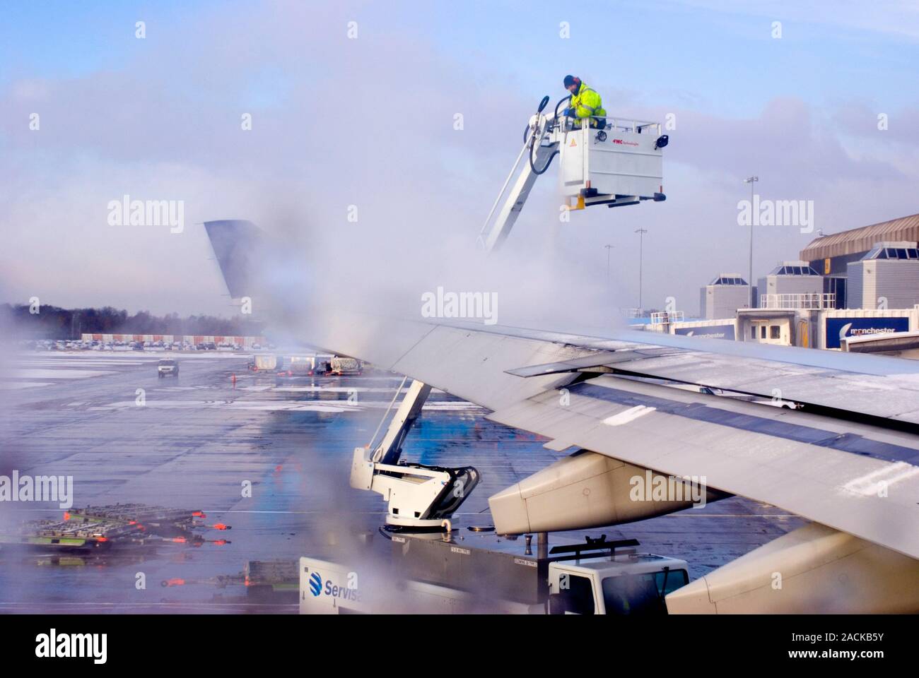 Aircraft deicing at Manchester Airport, UK Stock Photo - Alamy