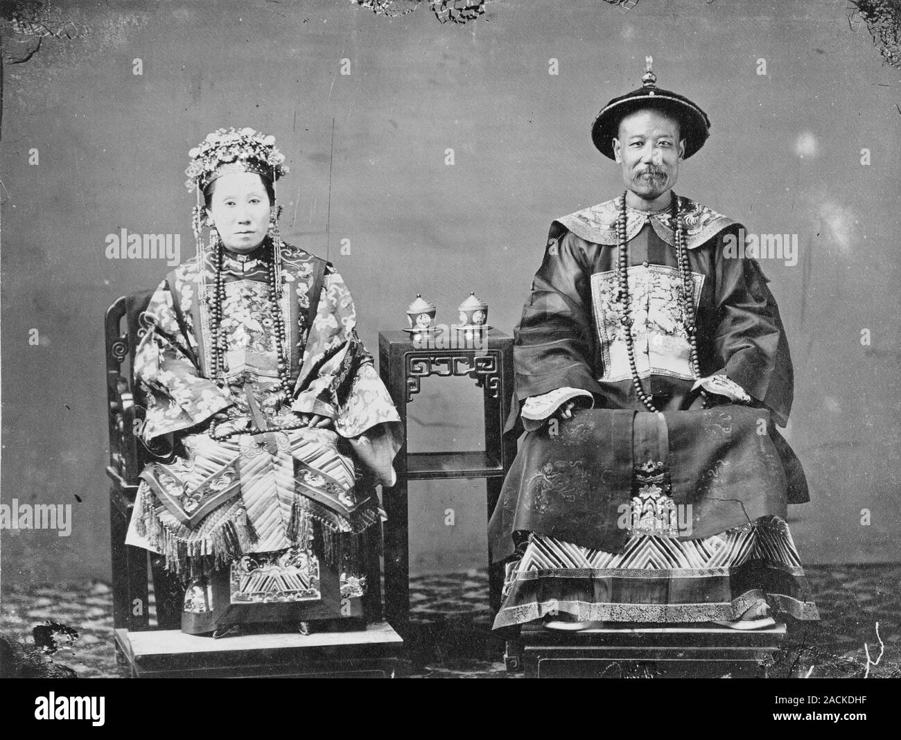 Chinese man and woman. Photographed during the voyage of HMS Challenger ...