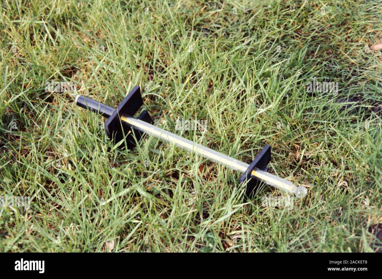 Weather thermometer. This is a grass minimum thermometer, being used to ...