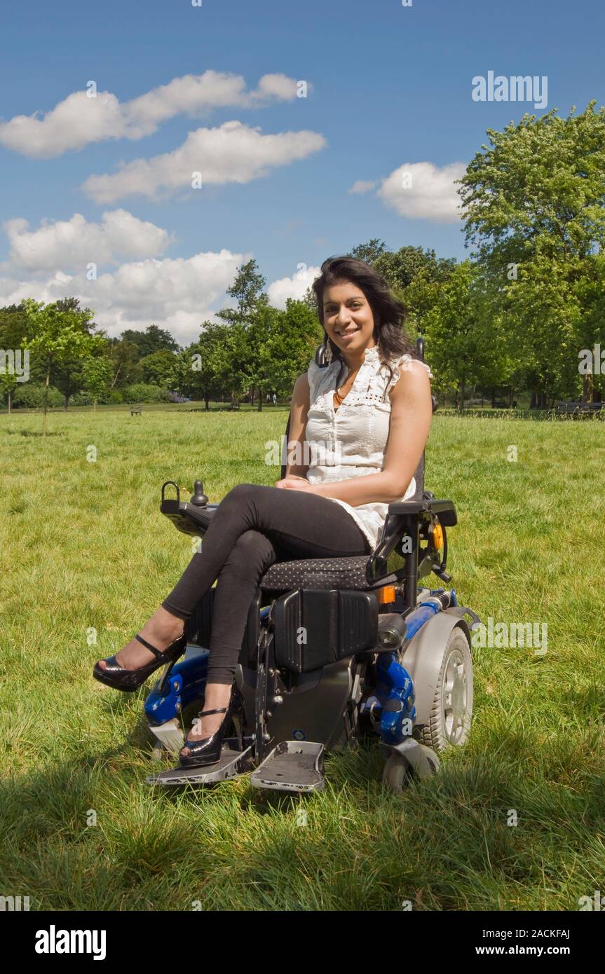 Woman with paraparesis in a wheelchair. She is 26 years old ...