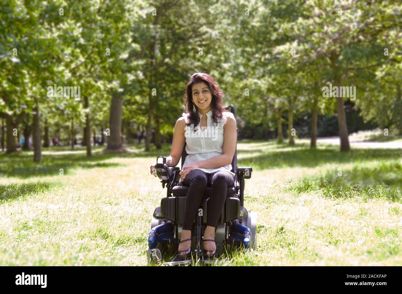 Woman with paraparesis in a wheelchair. She is 26 years old ...