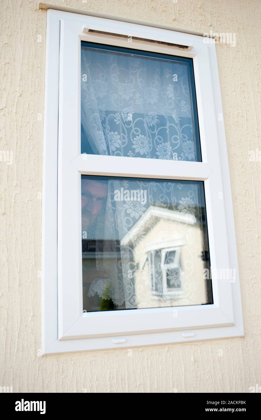 Agoraphobia. Elderly man suffering from agoraphobia (fear of going ...