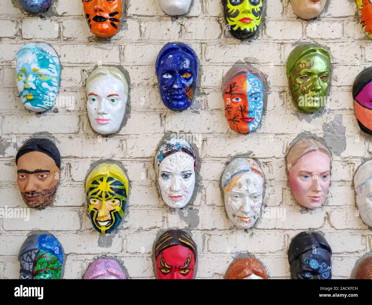 Moscow, Russia, 21 October 2019: Colorful painted ceramic faces ...