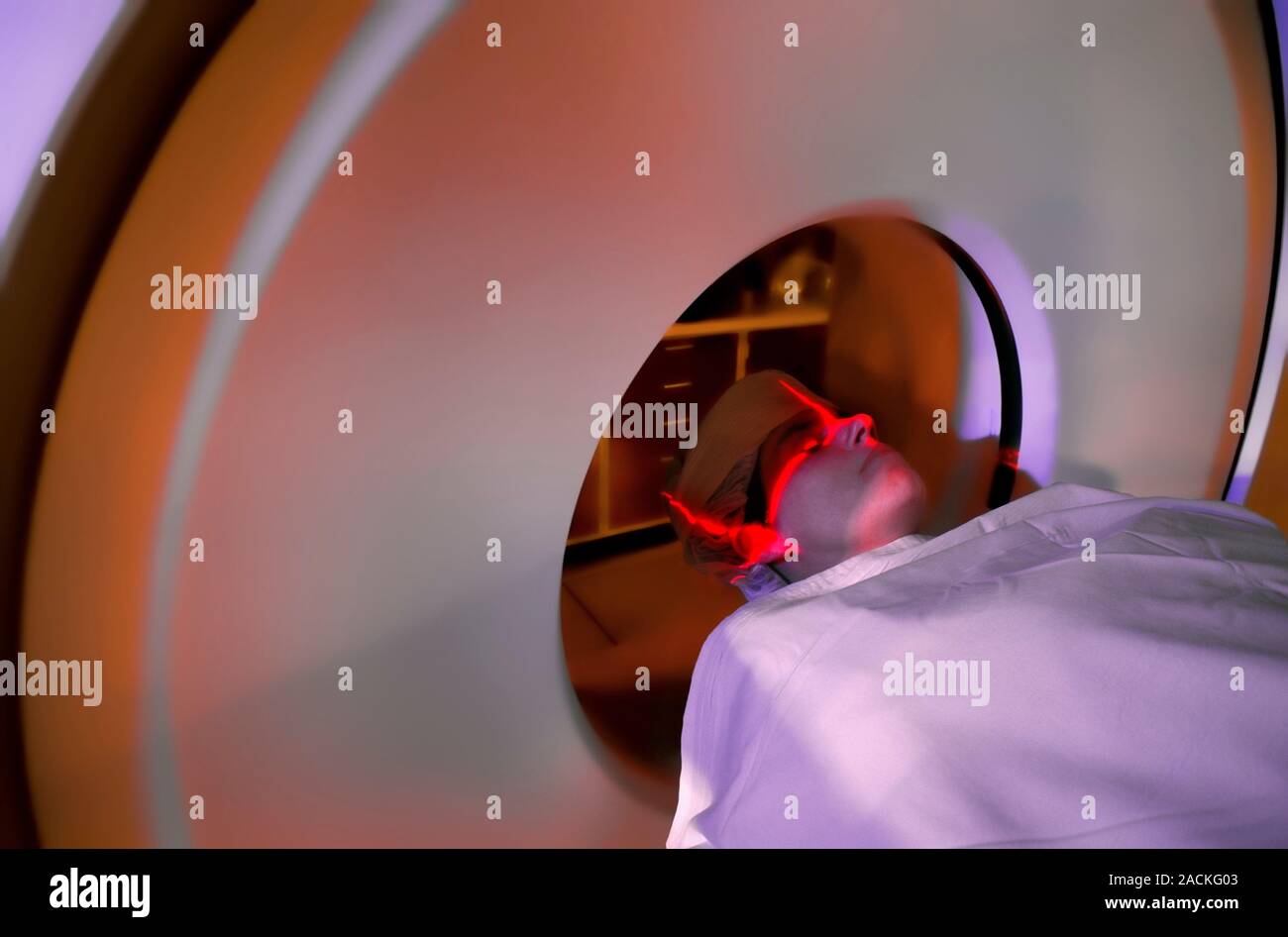 CT scan. Female patient in a computed tomography (CT) scanner. CT is a ...