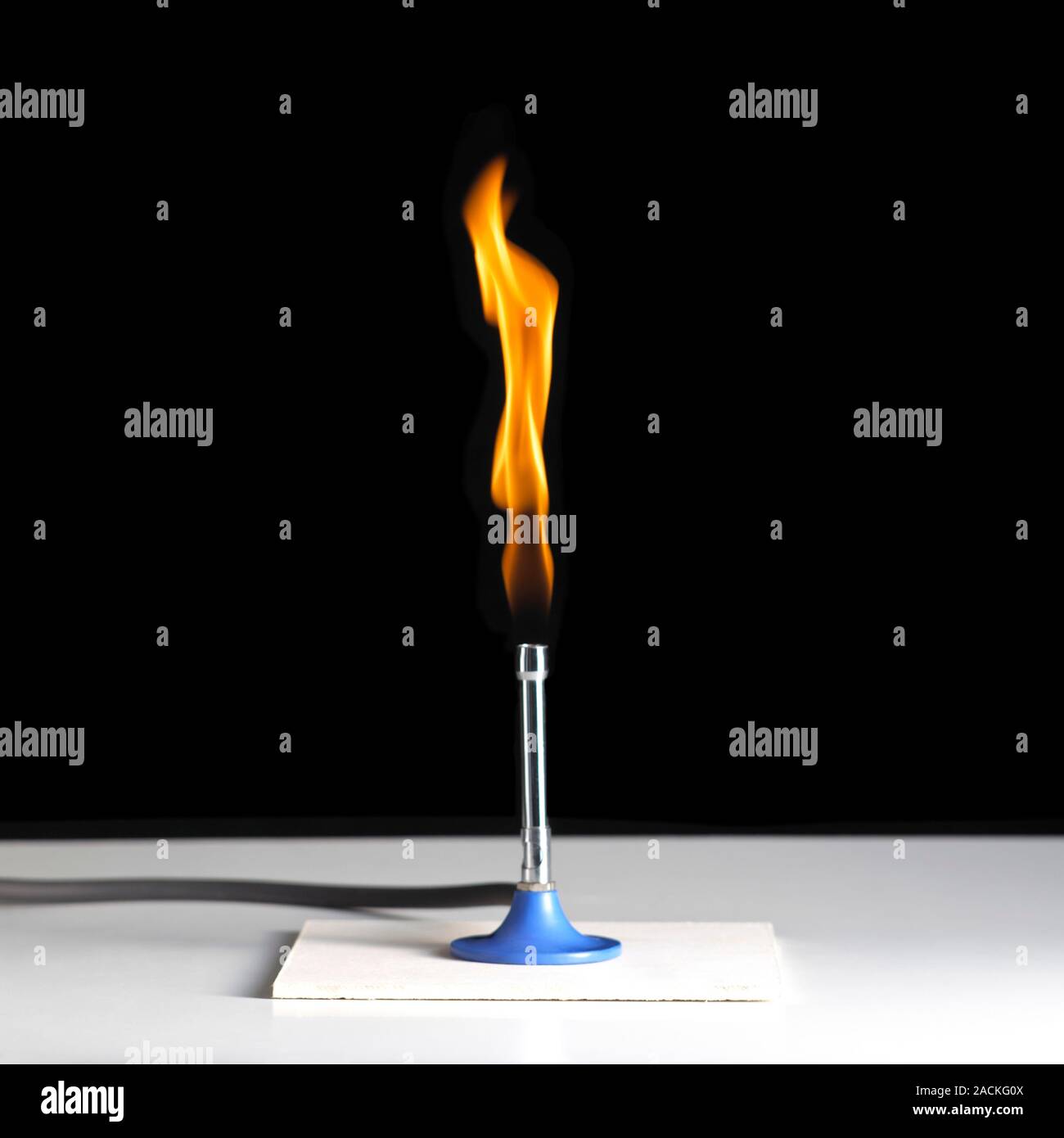 Bunsen burner flame. This device burns hydrocarbon gases (supplied ...