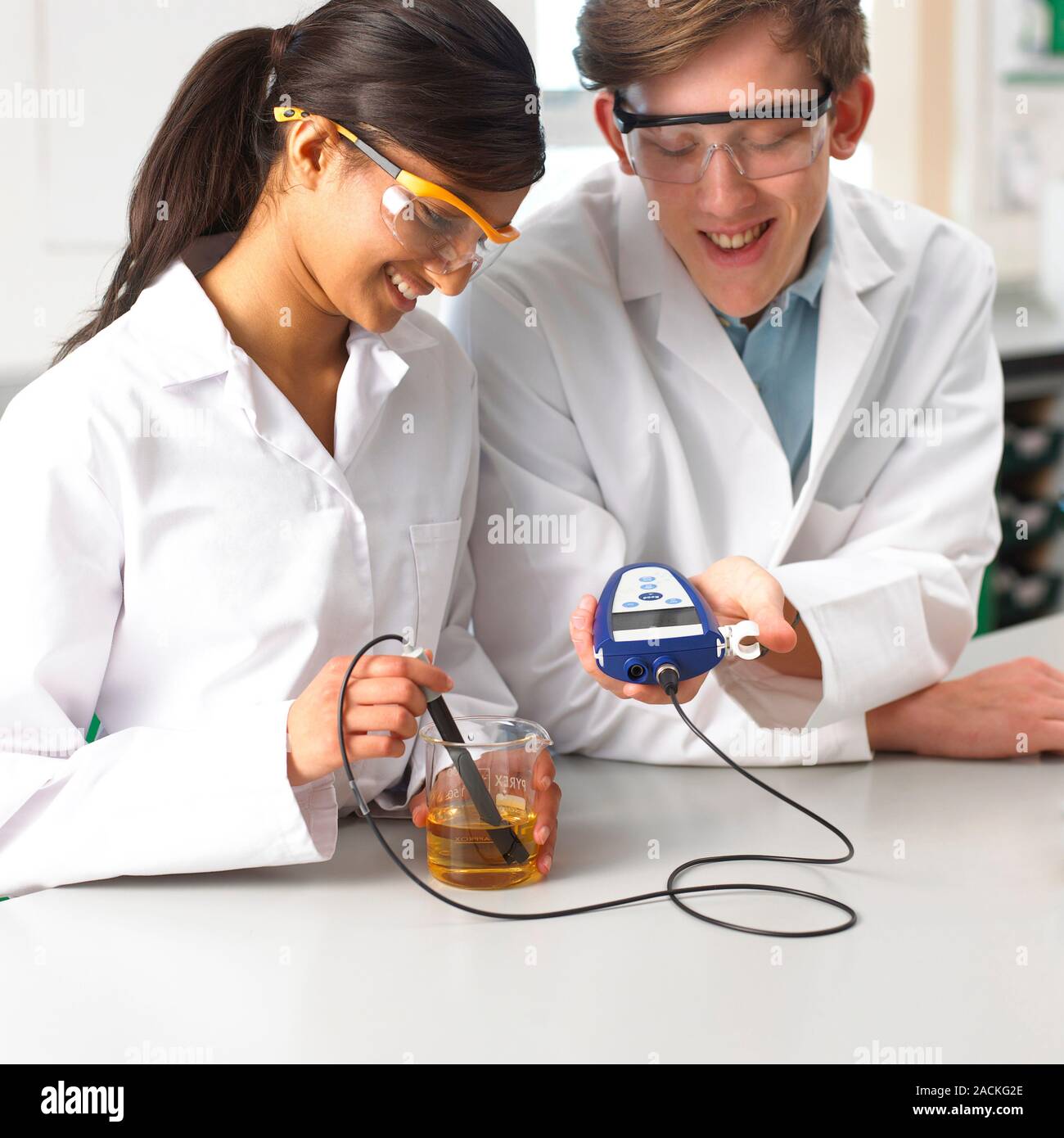 Digital pH measurement. Students using a digital pH meter to measure ...