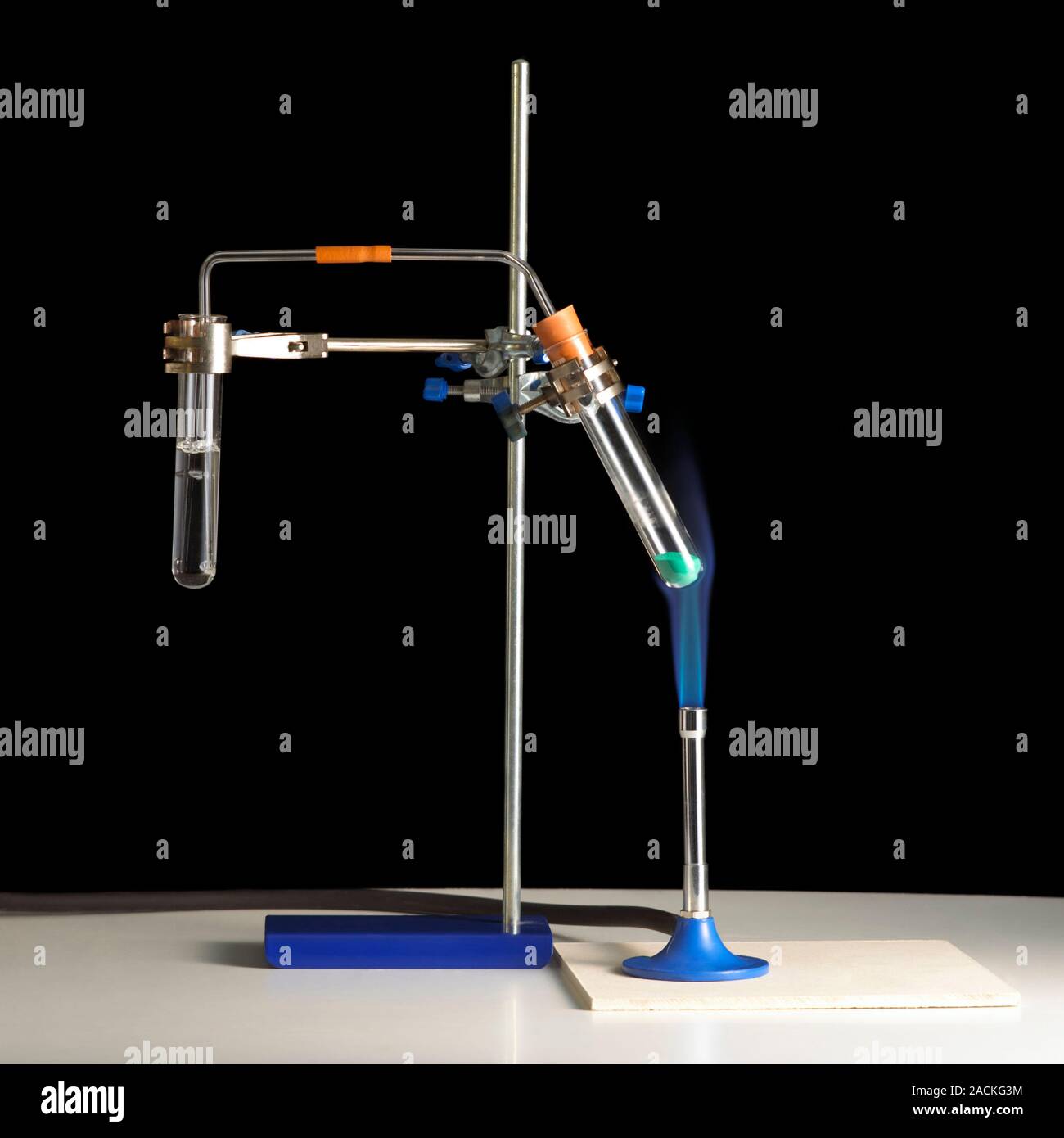 Heating copper (II) carbonate. Copper (II) carbonate being heated in a ...