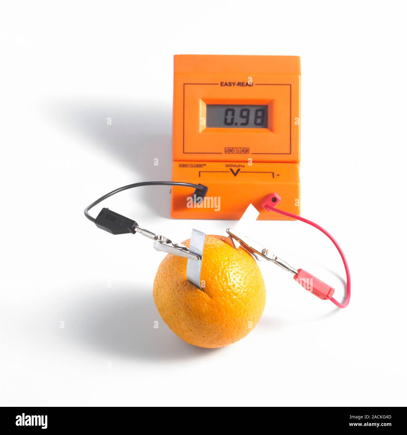 Orange battery. Copper (orange) and zinc (silver) electrodes have been ...