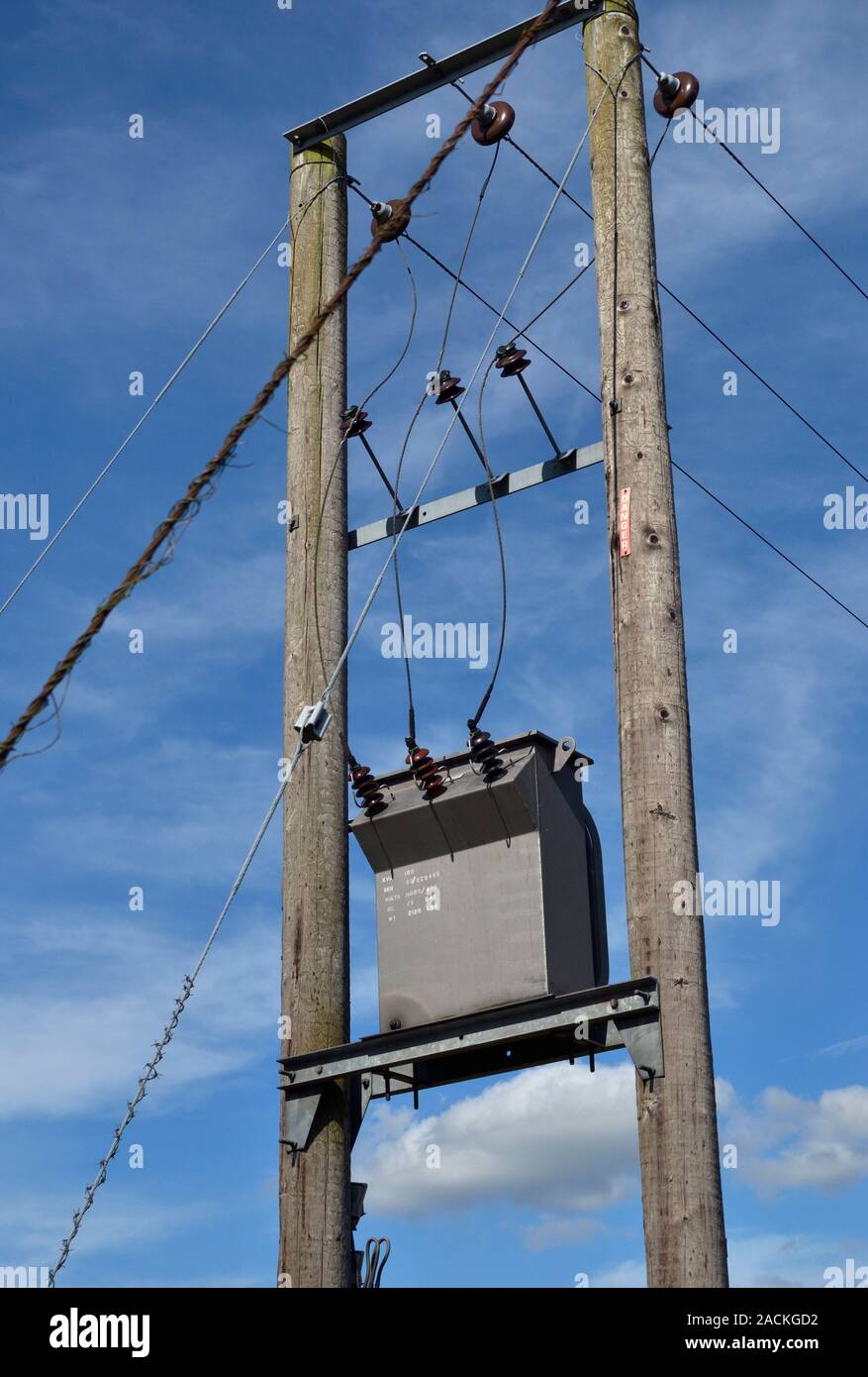 11000 volt power lines from local substation are connected to a ...
