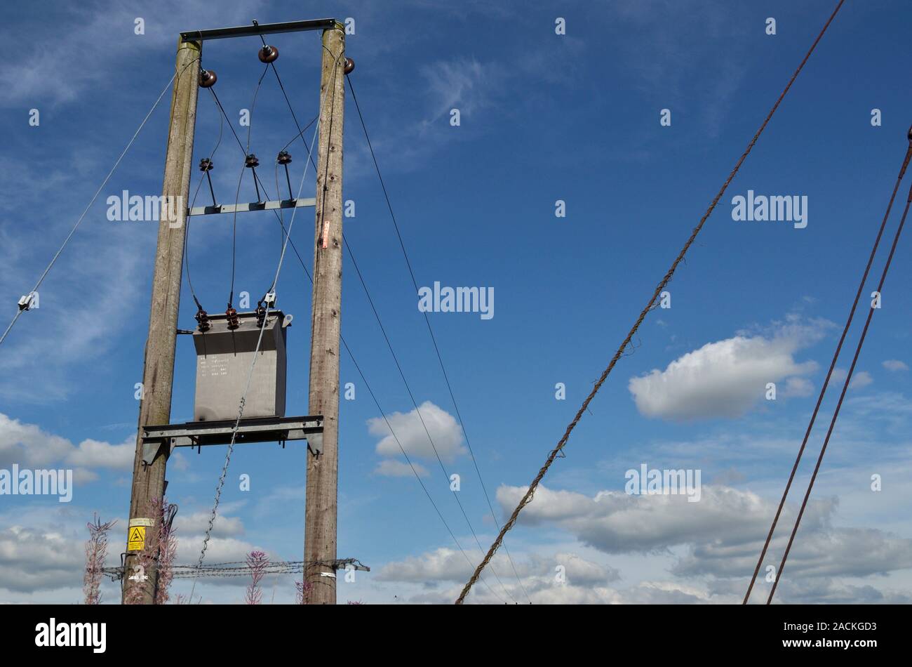 11000 volt power lines from local substation are connected to a ...