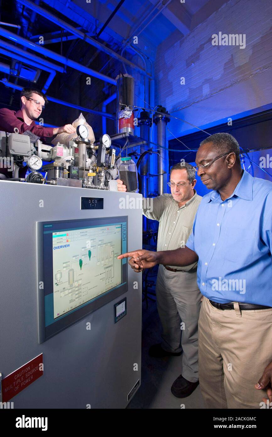 Bio-fuel production research. Chemical engineer (right) and mechanical ...