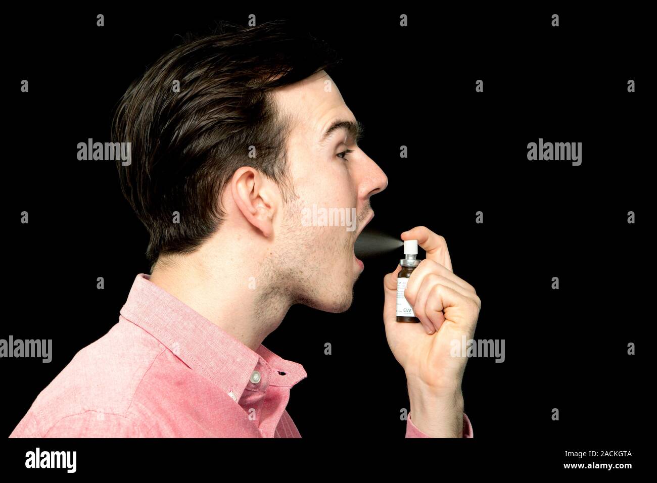 Sativex multiple sclerosis drug. Patient using a Sativex spray. This ...