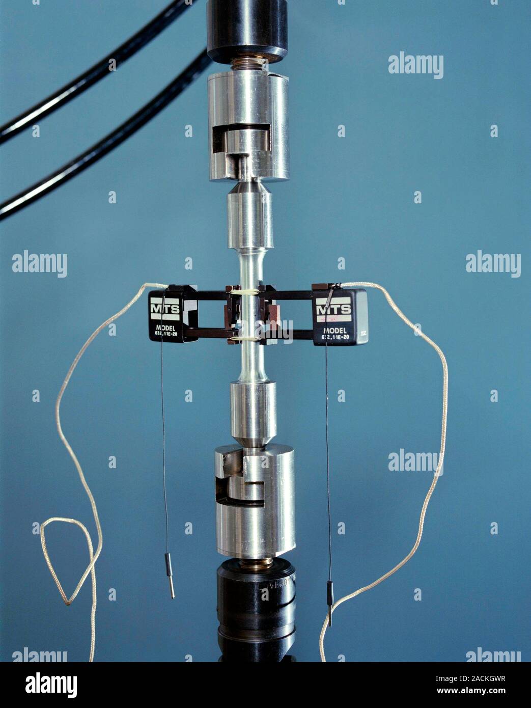 Tensile specimen in an MTS testing machine. Close-up of an aluminium ...