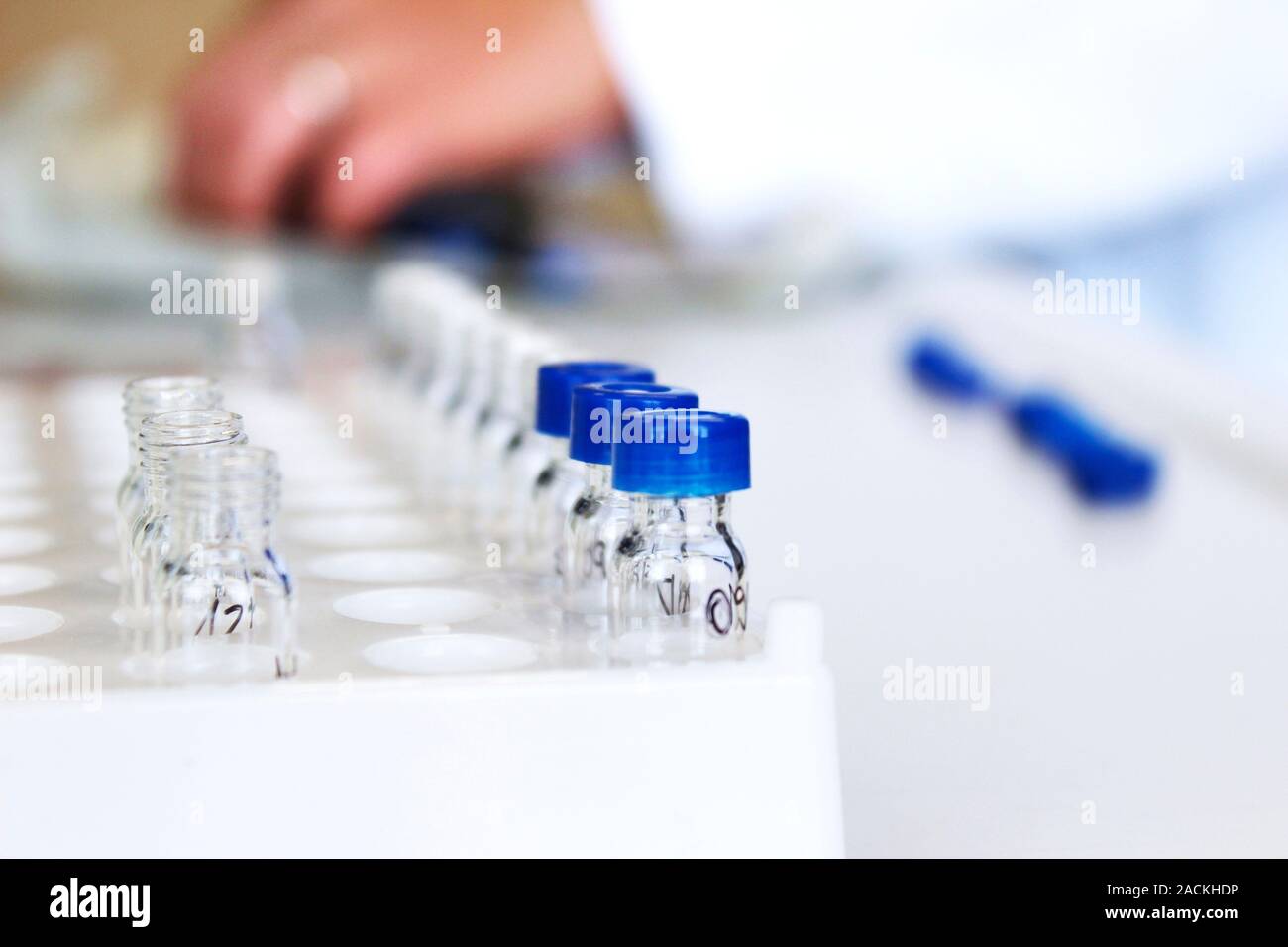 Glass sample bottles in a tray for laboratory analysis Stock Photo - Alamy