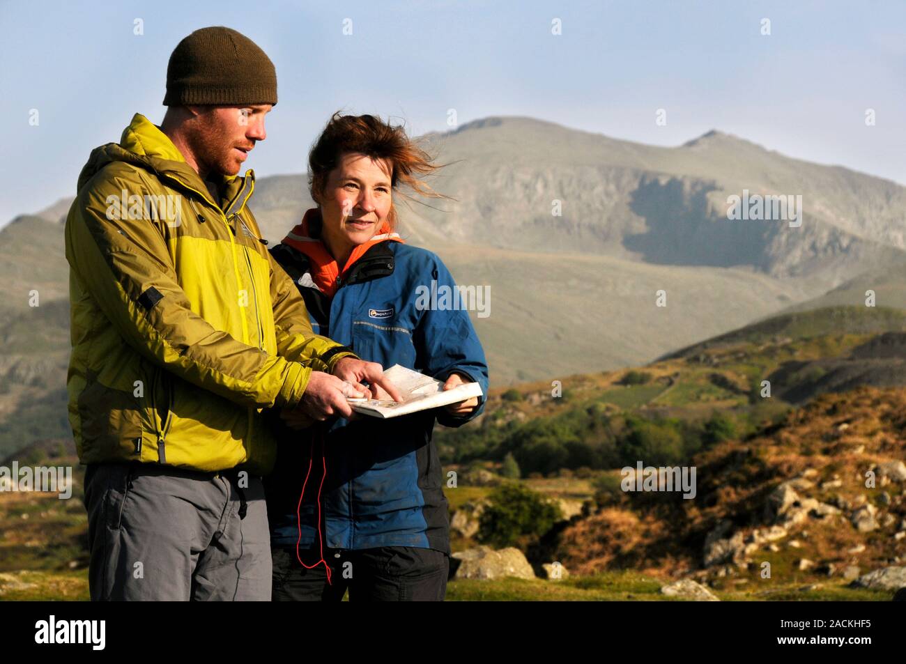 Mountain navigation, using a compass and map. Photographed in Snowdon ...