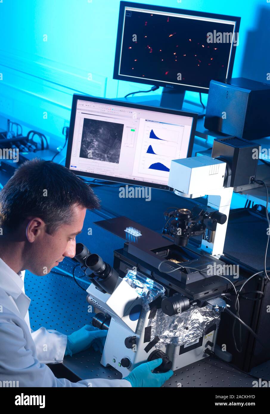 Cell biology laboratory. Scientist using super resolution single ...