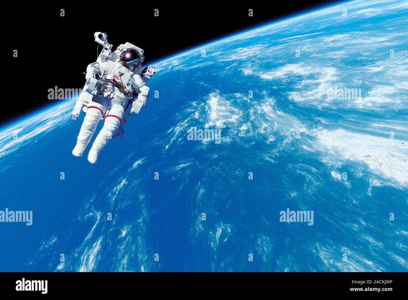 Space walk. Astronaut in a manned maneuvering unit (MMU) during an ...