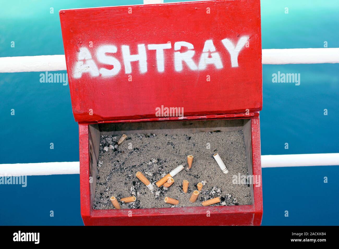 Ashtray on a ship. The sand is used to extinguish cigarettes, with some ...