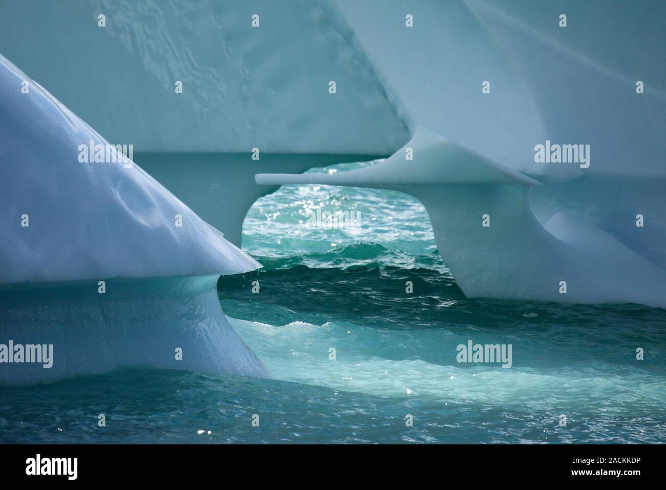 Wave-sculpted iceberg base. Close-up of the base of an iceberg, showing ...
