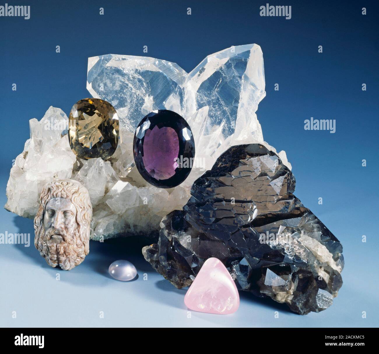 Quartz types. Colourless and smoky quartz crystals, including amethyst ...