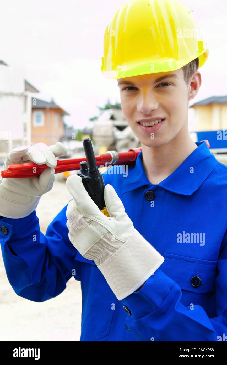 Apprentice / Trainee. Construction worker on site Stock Photo - Alamy