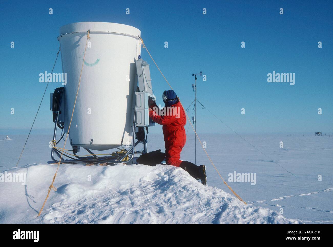 Antarctic research station. Researcher with the SODAR (SOnic Detection ...