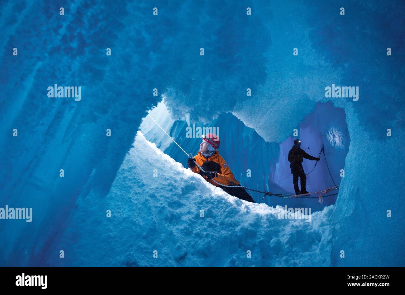 Ice cave. British Antarctic Survey (BAS) researchers inside a crevasse ...