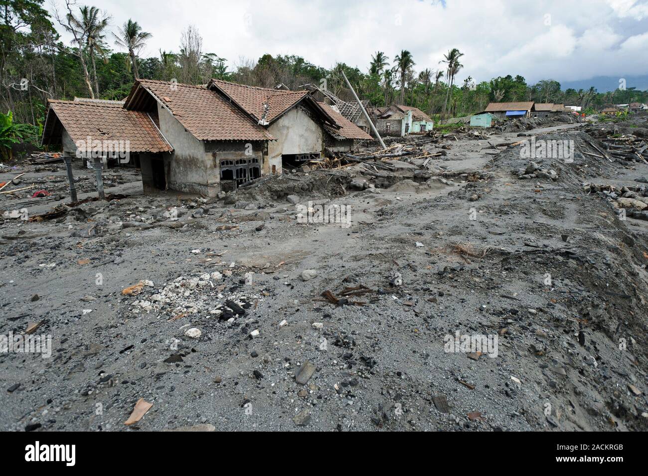 Volcanic destruction. Buildings at the edge of a pyroclastic flow from ...