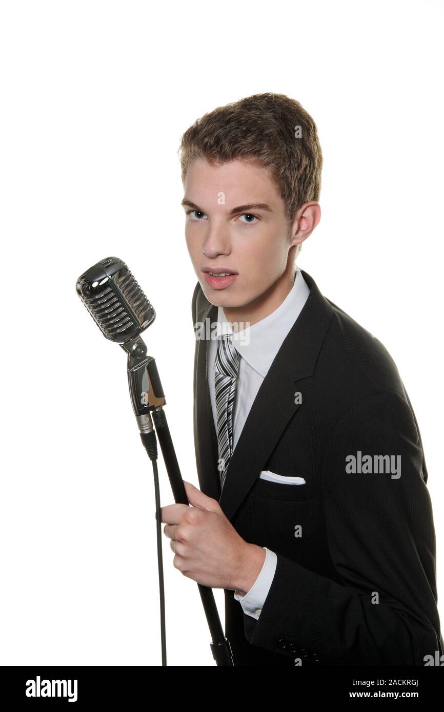 Young singer with retro microphone Stock Photo - Alamy