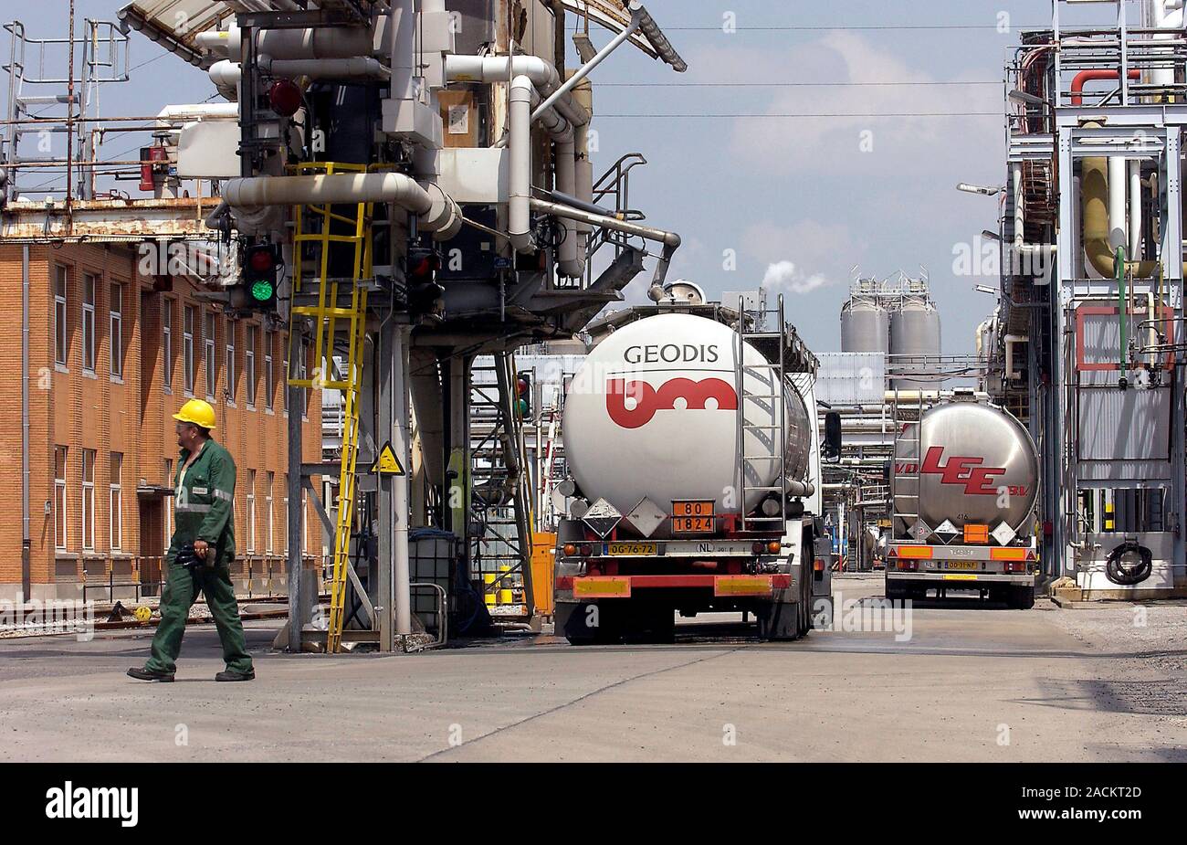 Chemical plant. Tankers being loaded at a chemical plant. Photographed ...