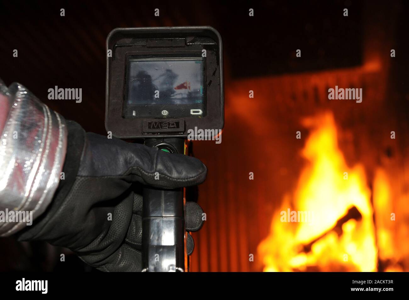 Thermal imaging camera. Fire protection specialist using a imaging ...