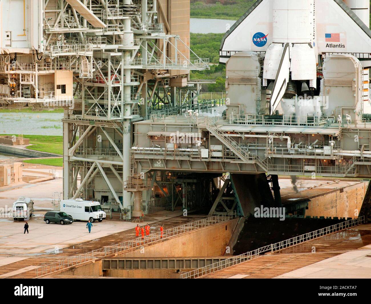 Space Shuttle final flight. STS-135 crew (orange, lower left) on ...