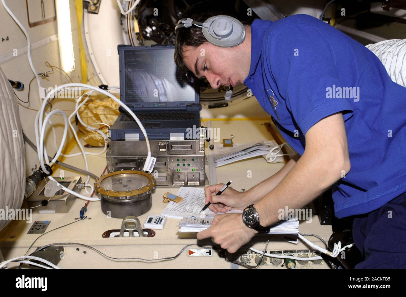 ISS maintenance. Russian cosmonaut Sergei Volkov (born 1973) working in ...
