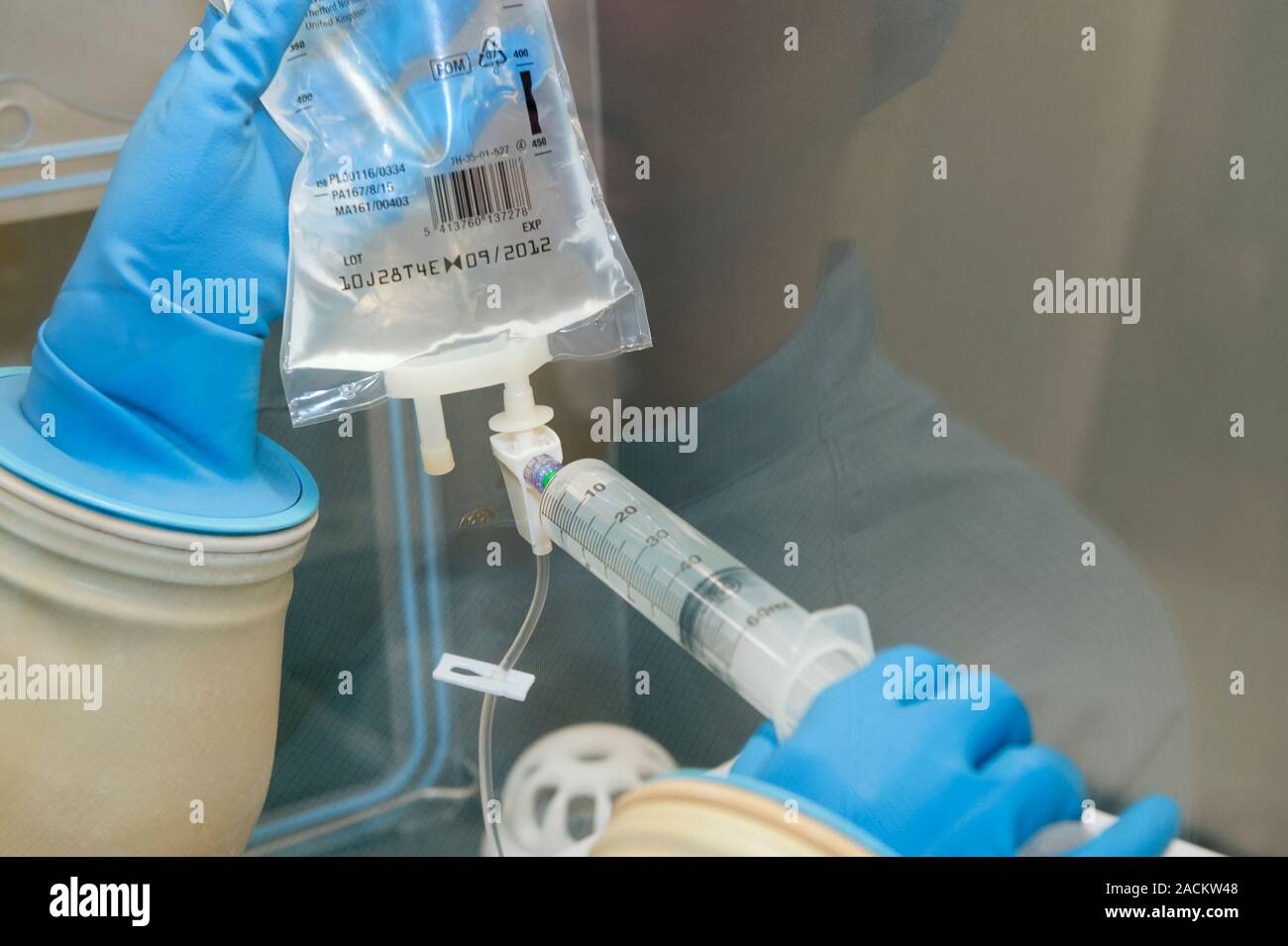 Chemotherapy drugs being prepared within an isolator cabinet Stock ...