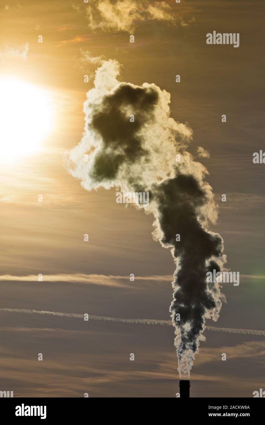 smoking chimneys of a factory Stock Photo - Alamy